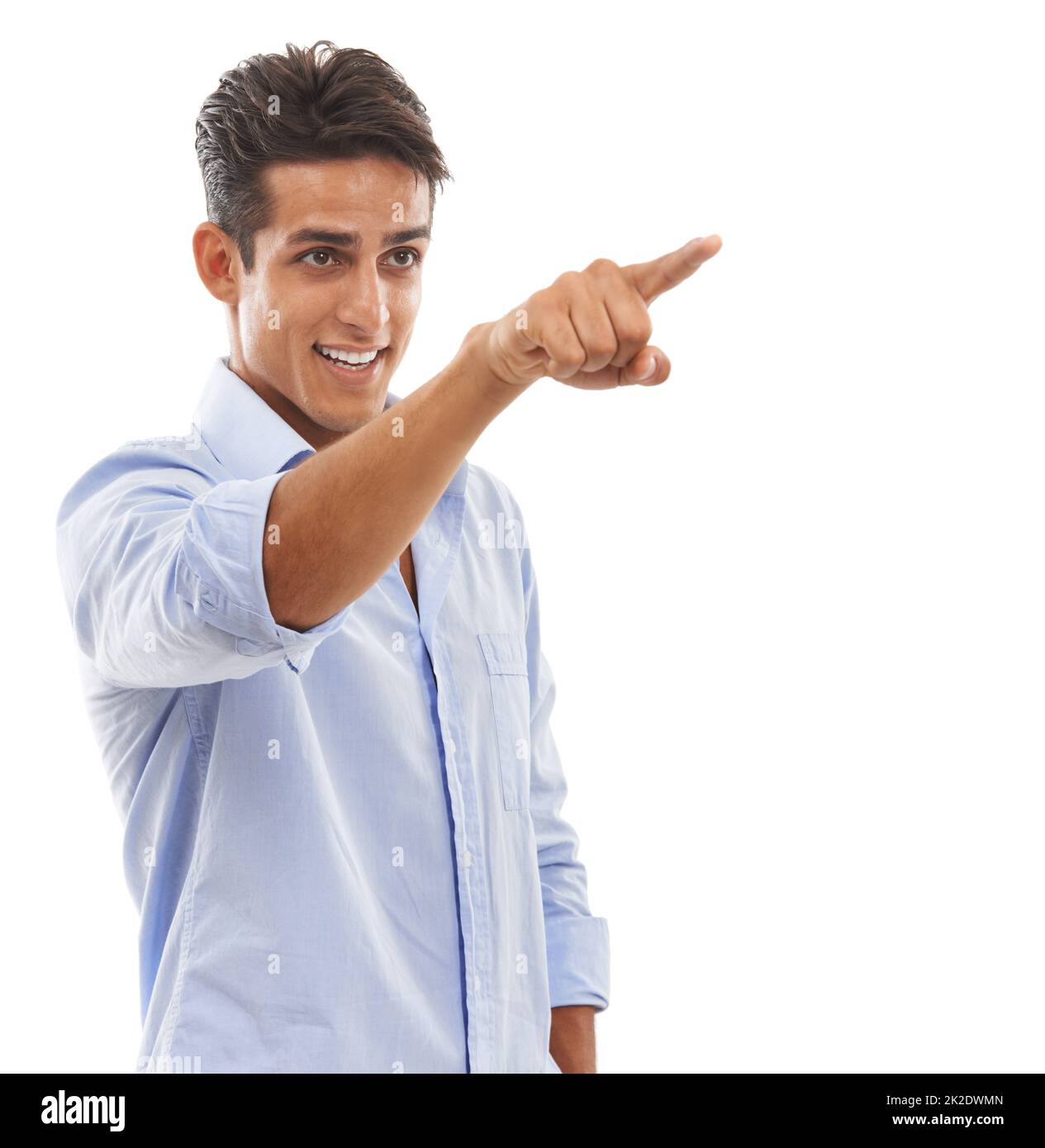 Showing you the way. A handsome young man pointing his finger and ...