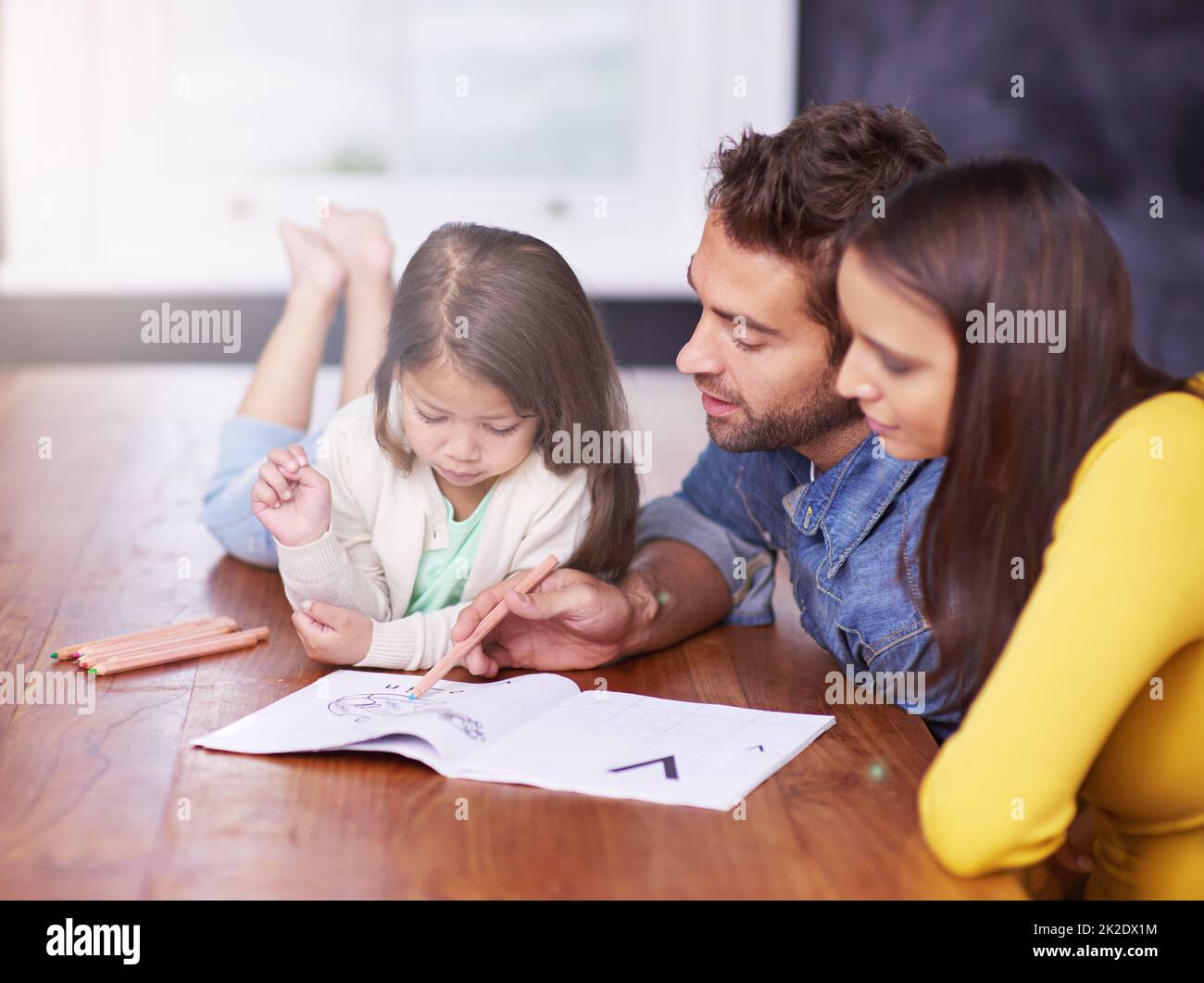Children doing drawing work parents hi-res stock photography and images ...