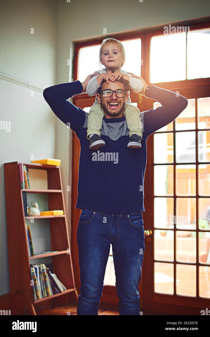 Happy child on an adults shoulders hi-res stock photography and images - Alamy