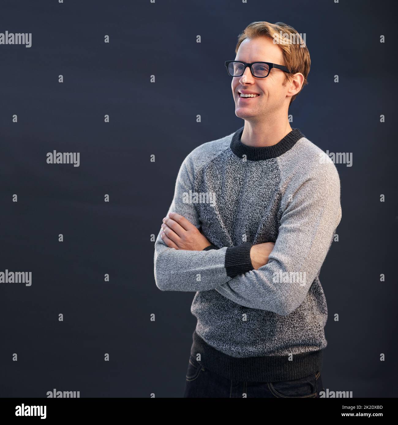Think positive. a man standing thoughtfully in a studio Stock Photo - Alamy