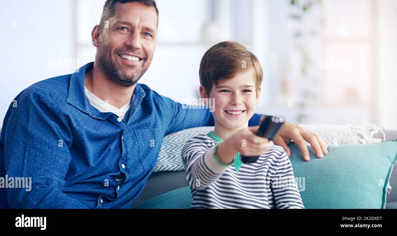 Were going to be couch potatoes today. Shot of a cheerful father and ...