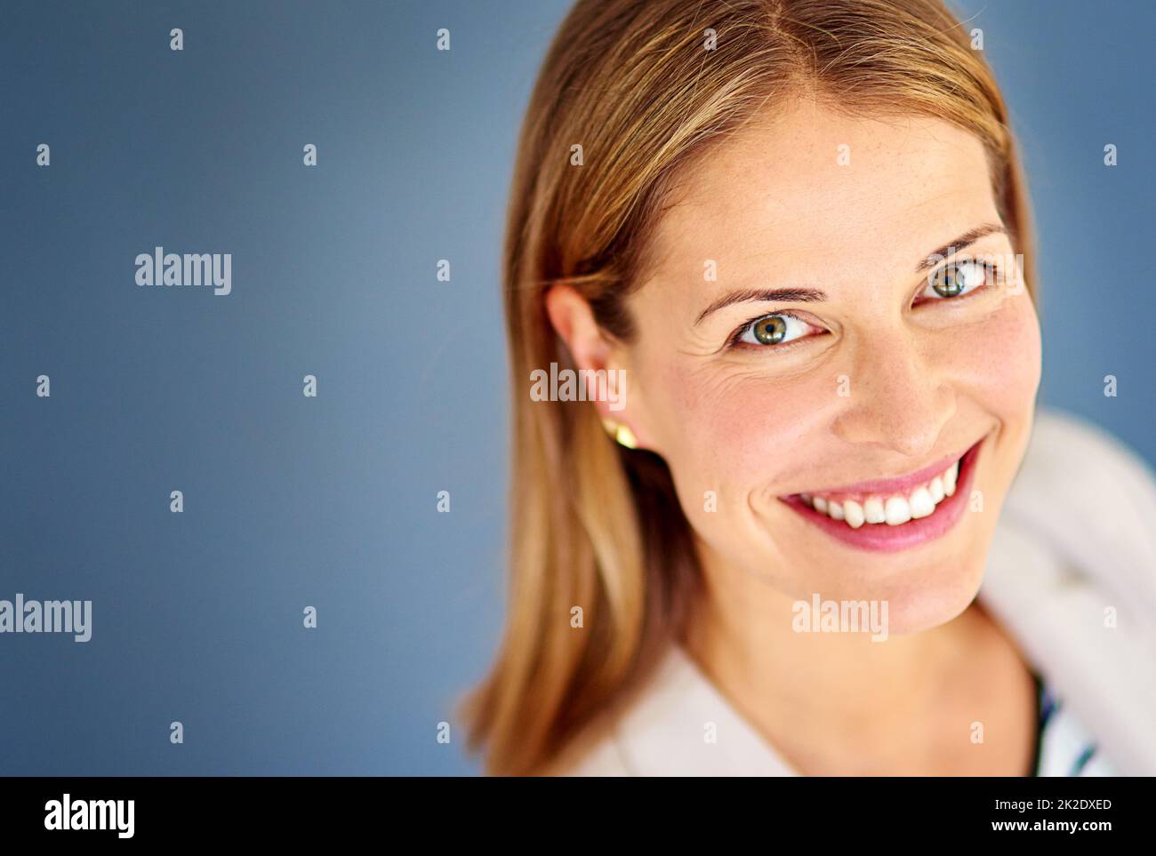 Shes Got What It Takes To Succeed Shot Of A Woman Dressed In Office Wear Posing Against A Blue