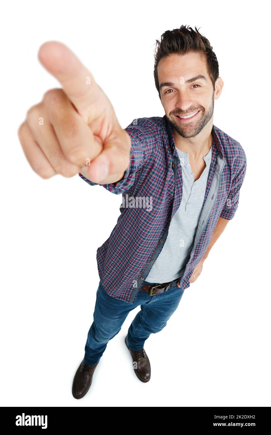 It doesnt get any bigger than this. Studio shot of a young man pointing ...