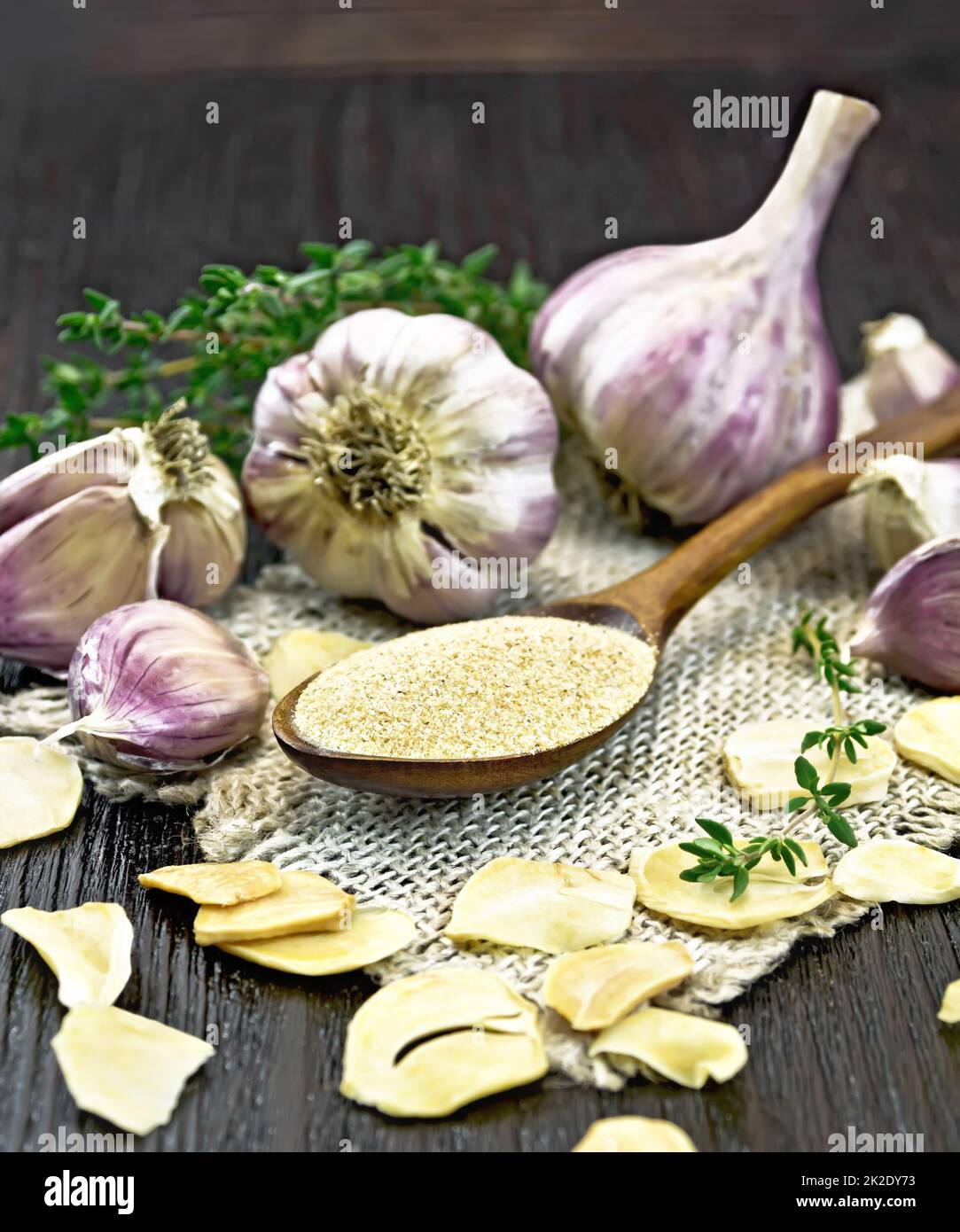 Garlic ground in spoon on board Stock Photo - Alamy