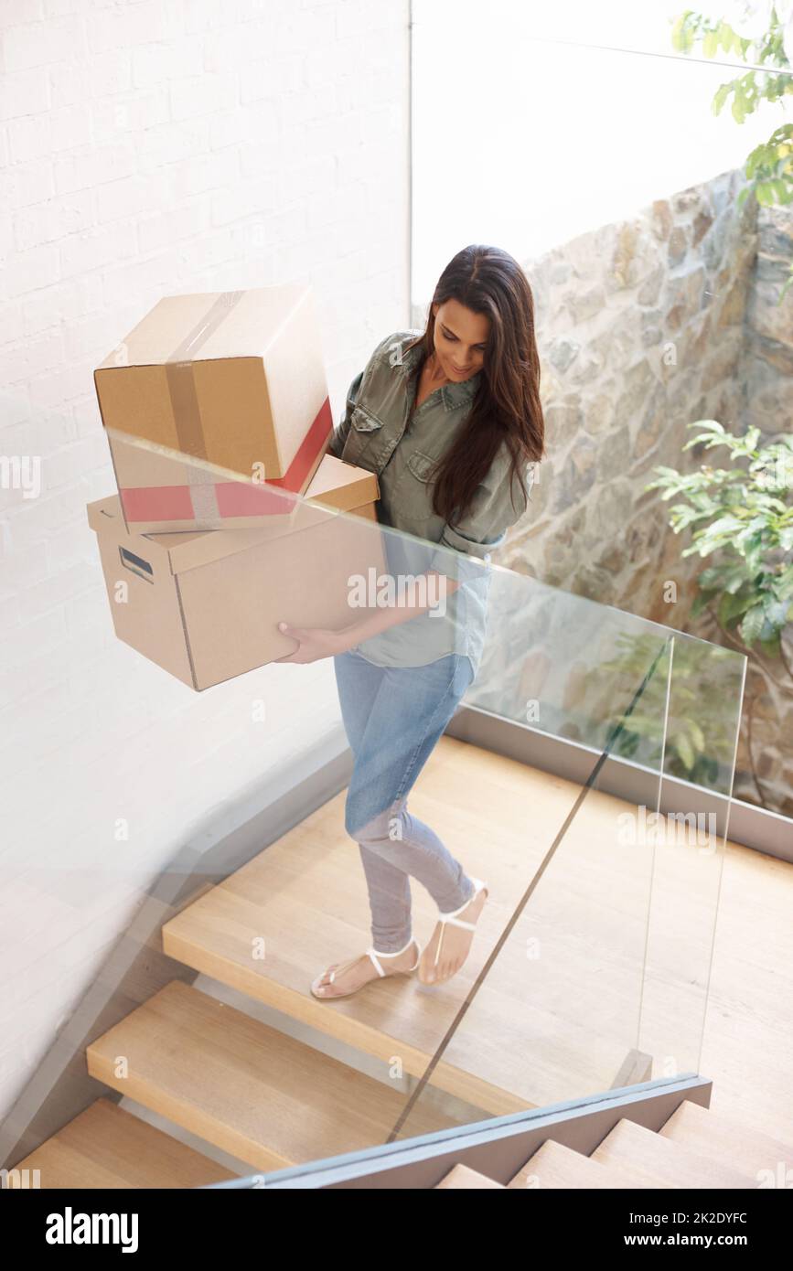 Woman carrying cardboard boxes hi-res stock photography and images - Alamy