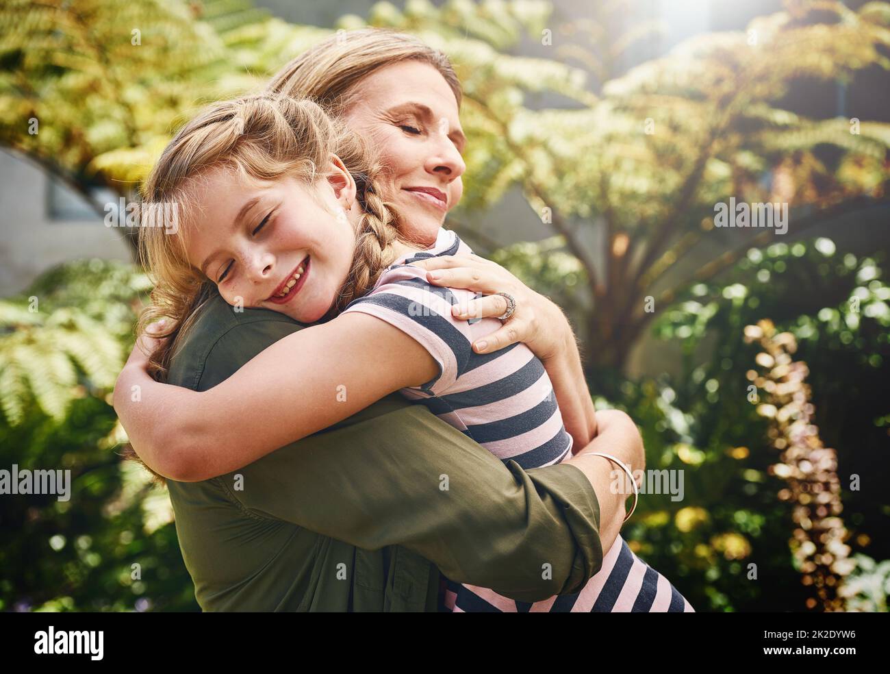 Daughter hugging her parents hi-res stock photography and images - Alamy