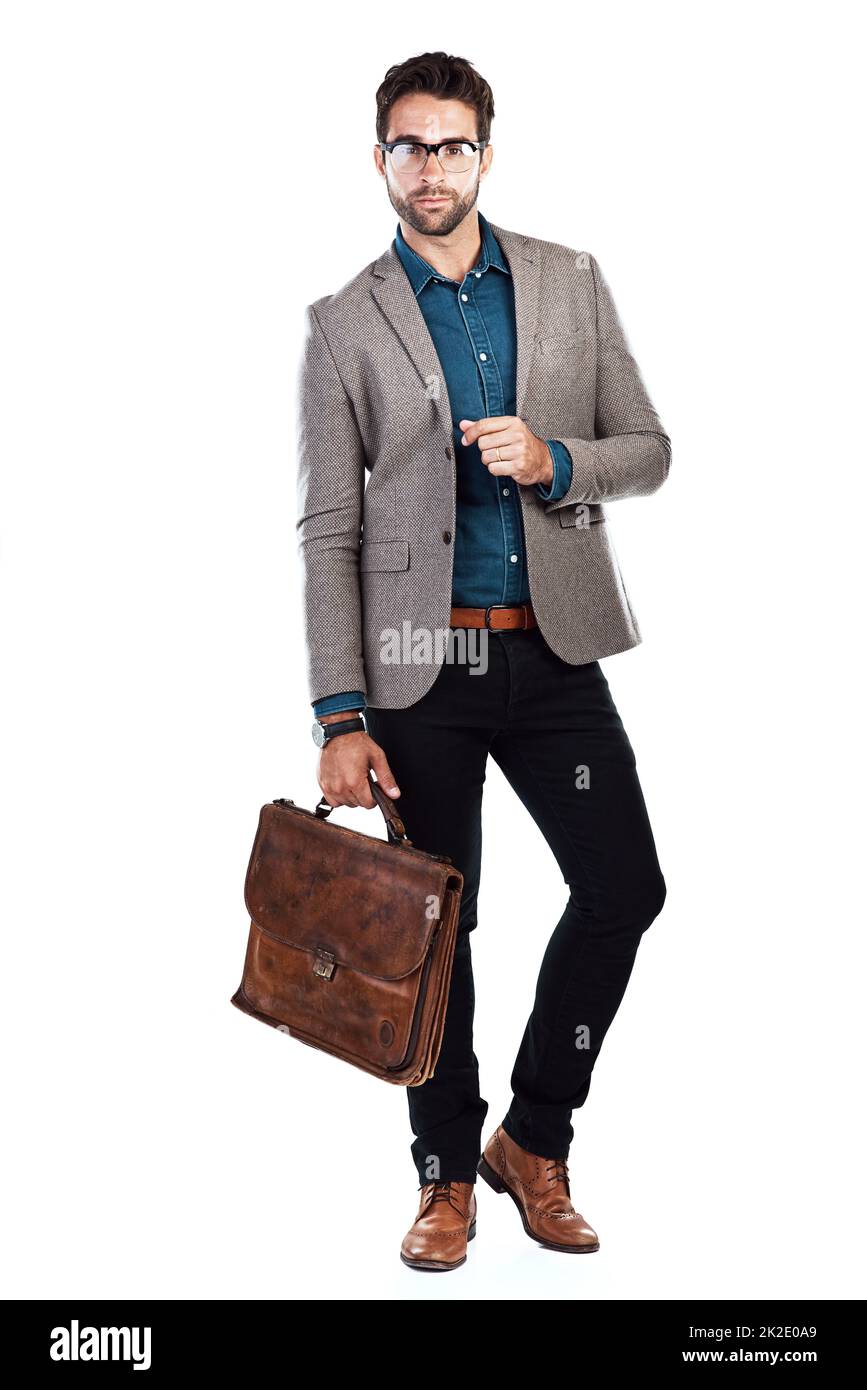All man, all style. Studio shot of a handsome young man posing against ...