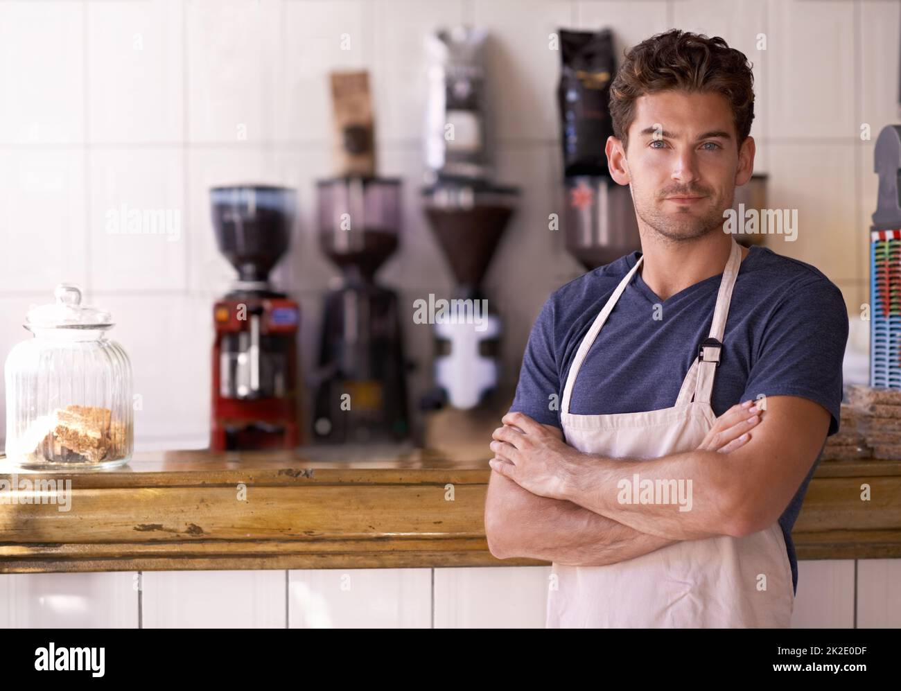 You name the blend and hell make it. Portrait of a young male barista ...