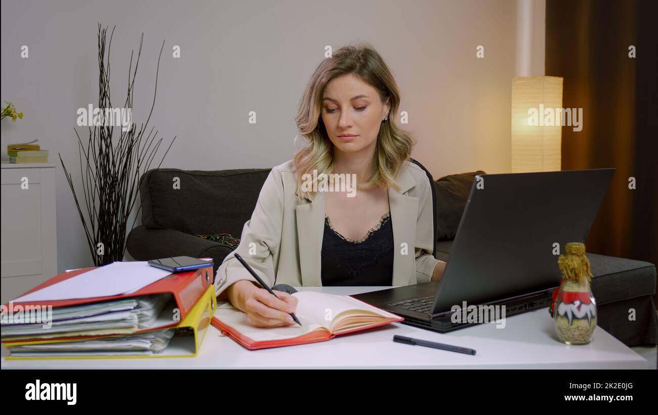 Young busy business woman working on project paperwork Stock Photo - Alamy