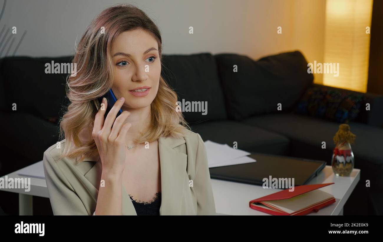 Blonde pretty woman have an important phone conversation. Close up ...