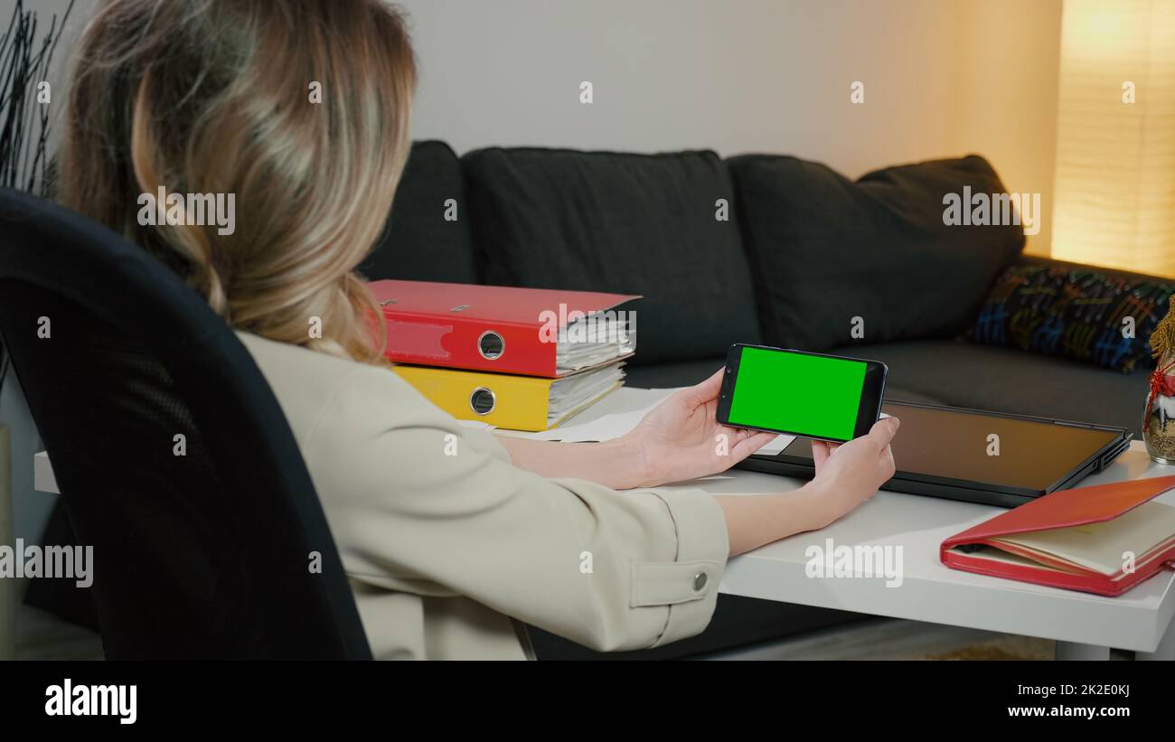 Back View of Woman at Phone with Green Screen for Copy Space. Business ...