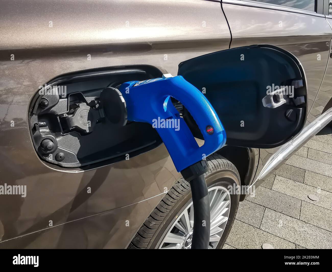 Electric car is refueled Stock Photo - Alamy