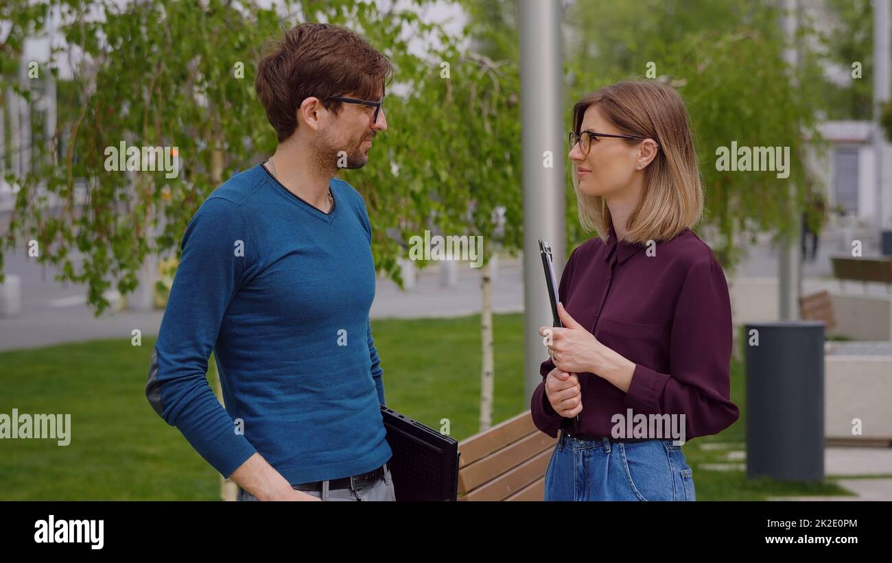 Man and Woman talking Outdoor City Park Business problems resolve ...
