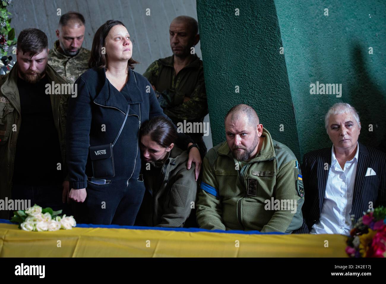 Kyiv, Ukraine. 16th Sep, 2022. Relatives and friends mourn during a ...