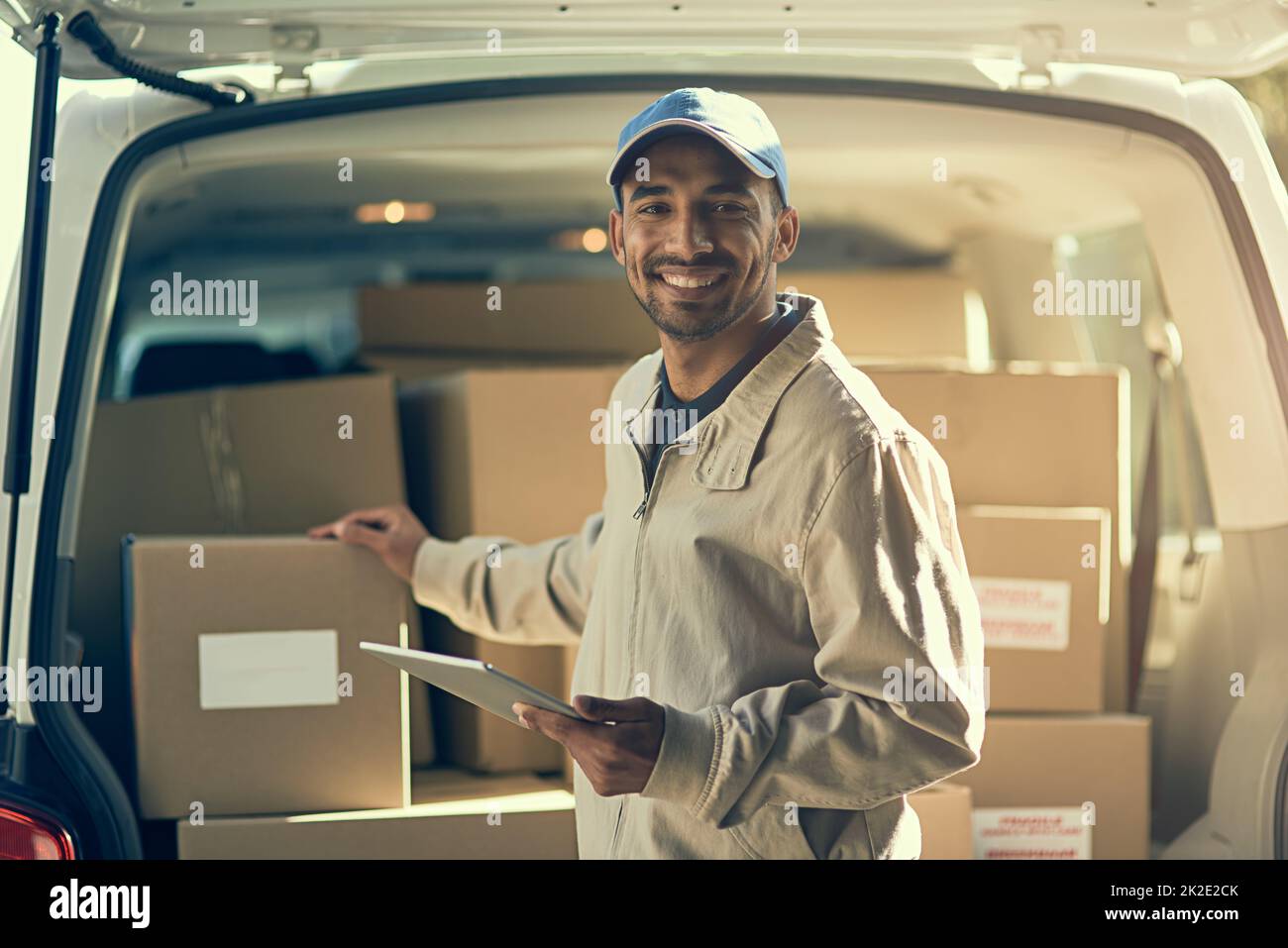 Maintaining fast and efficient delivery. Portrait of a delivery man ...