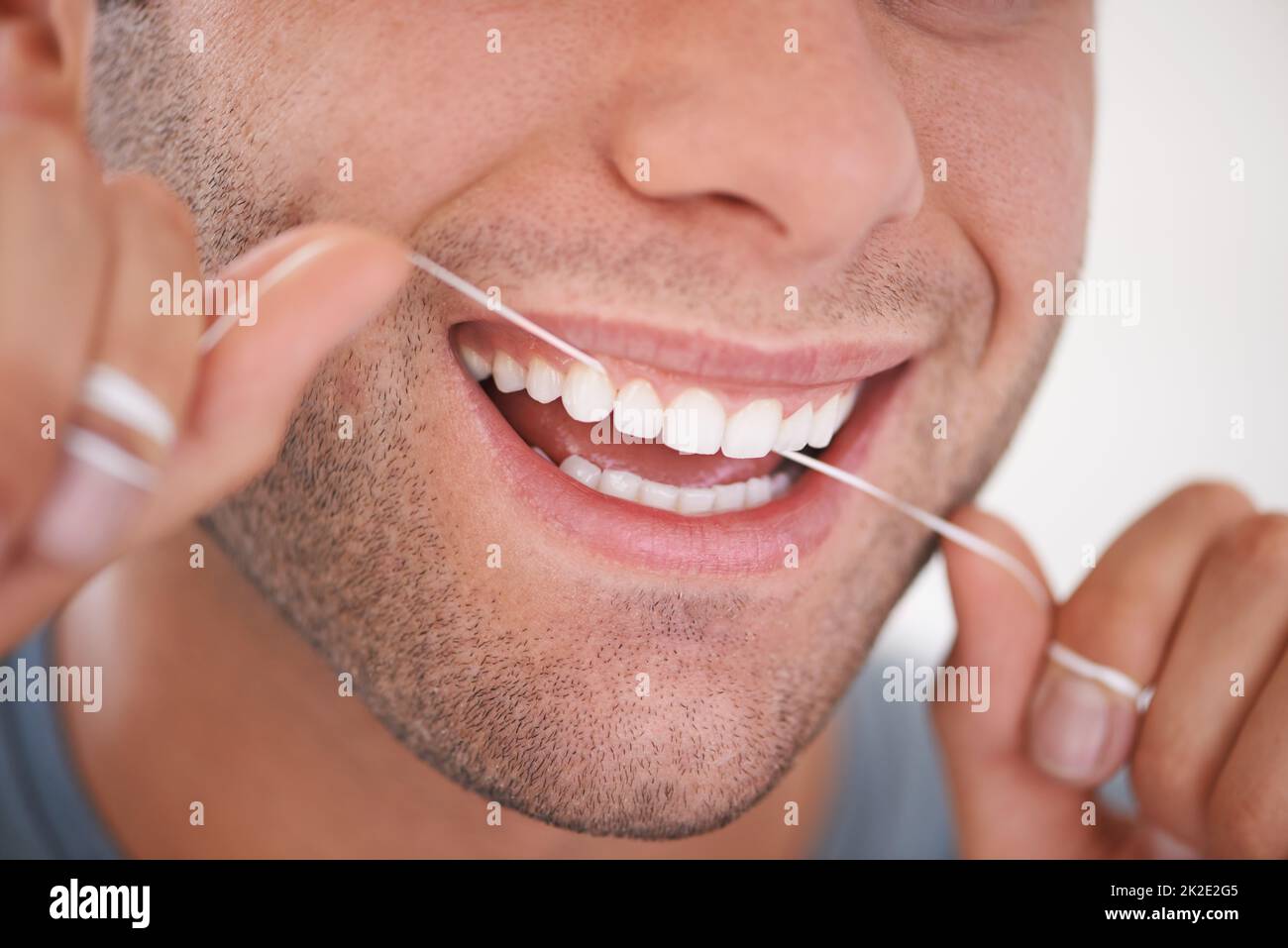 Oral hygiene. Cropped shot of a man flossing his teeth Stock Photo - Alamy