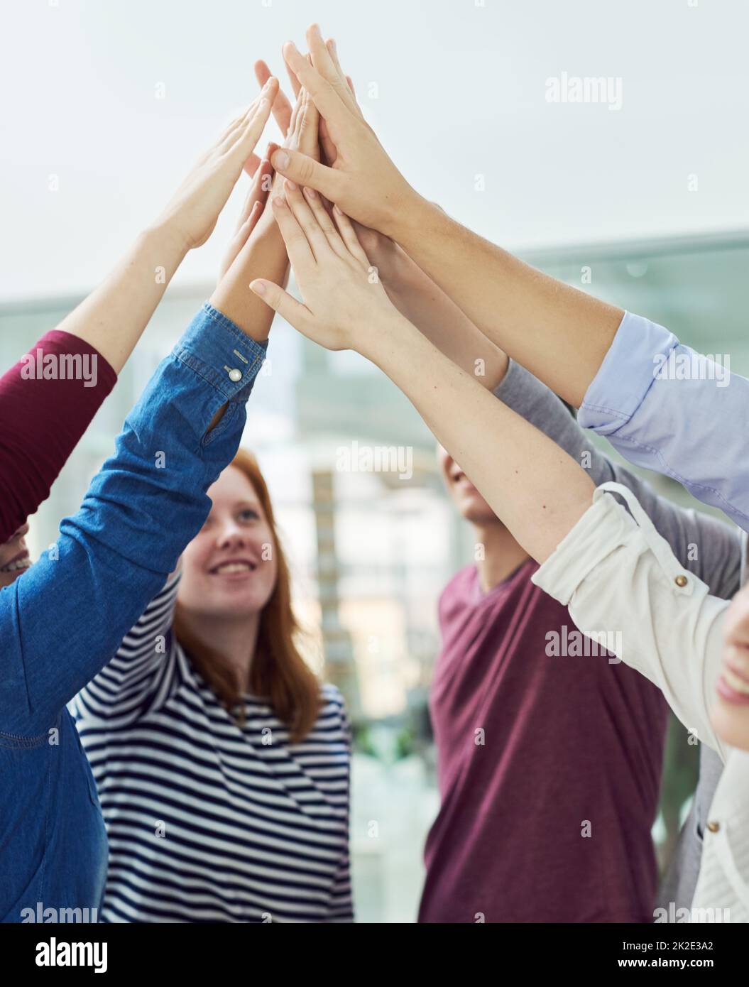Group of people putting hands up hi-res stock photography and images ...