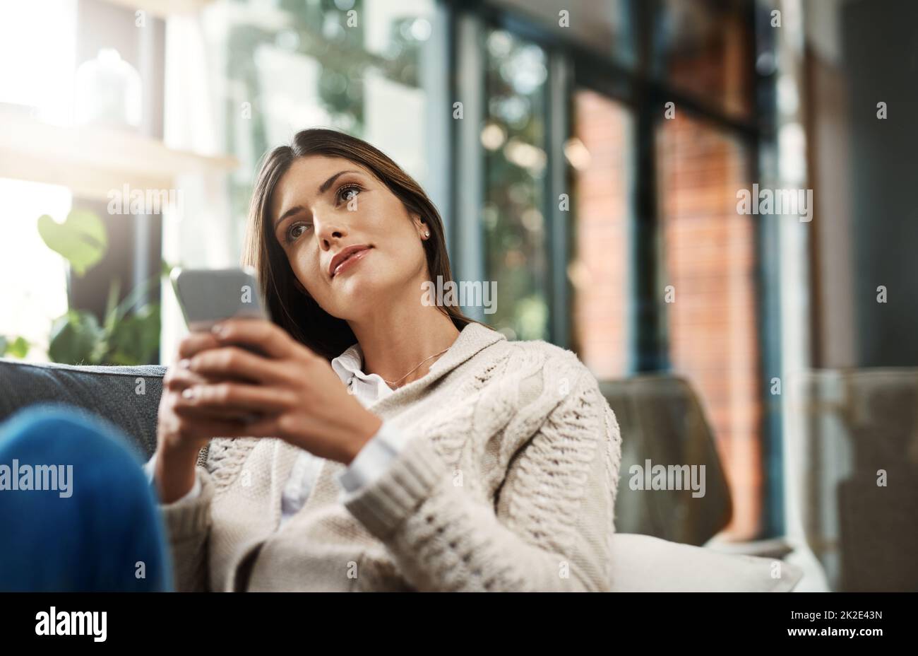 Maybe its time I sent that message. Shot of an attractive young woman ...