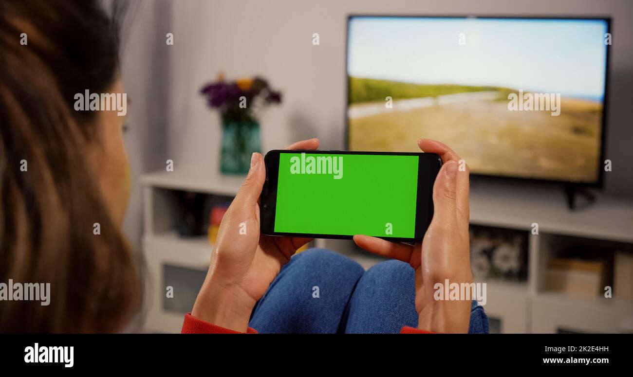 Woman Using Smartphone With Green Screen For Copy Space Close Up Chroma Key Mockup Scrolling