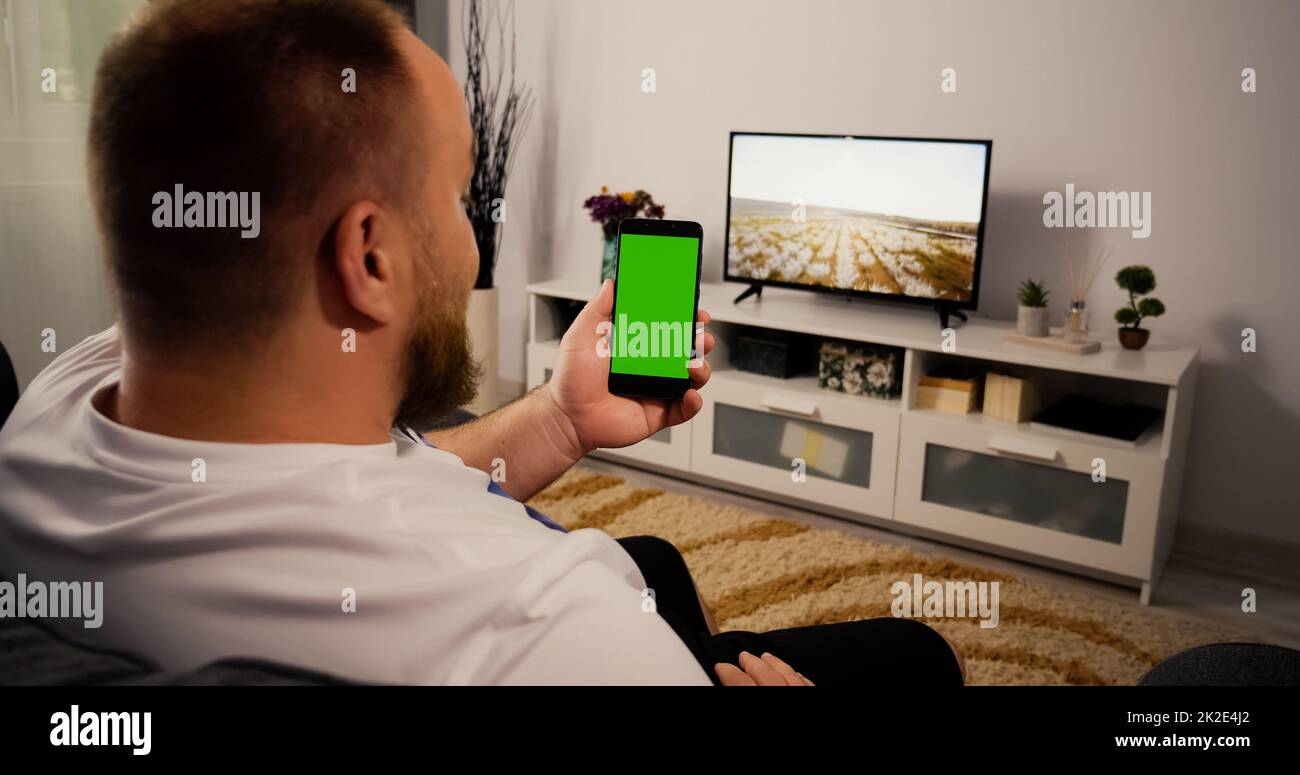 Man talking with friend in a Video Call Smartphone Green screen and ...