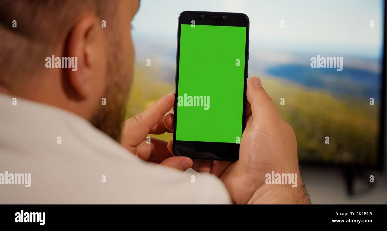 Man Watching On Smartphone Green Screen For Copy Space Chroma Key Mockup Tracking Markers And