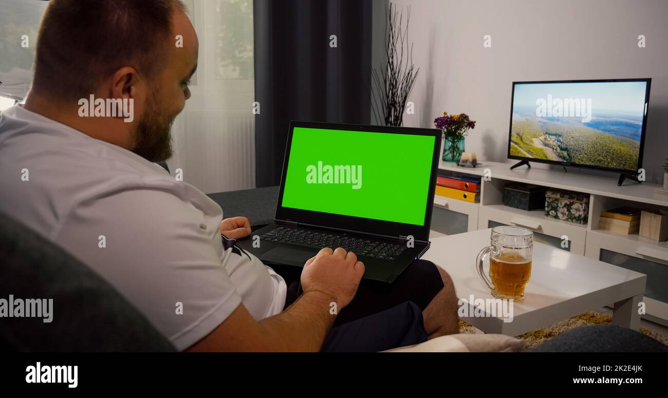 Man Using Laptop with Greenscreen and Chroma Key. Mock Up with Tracking ...