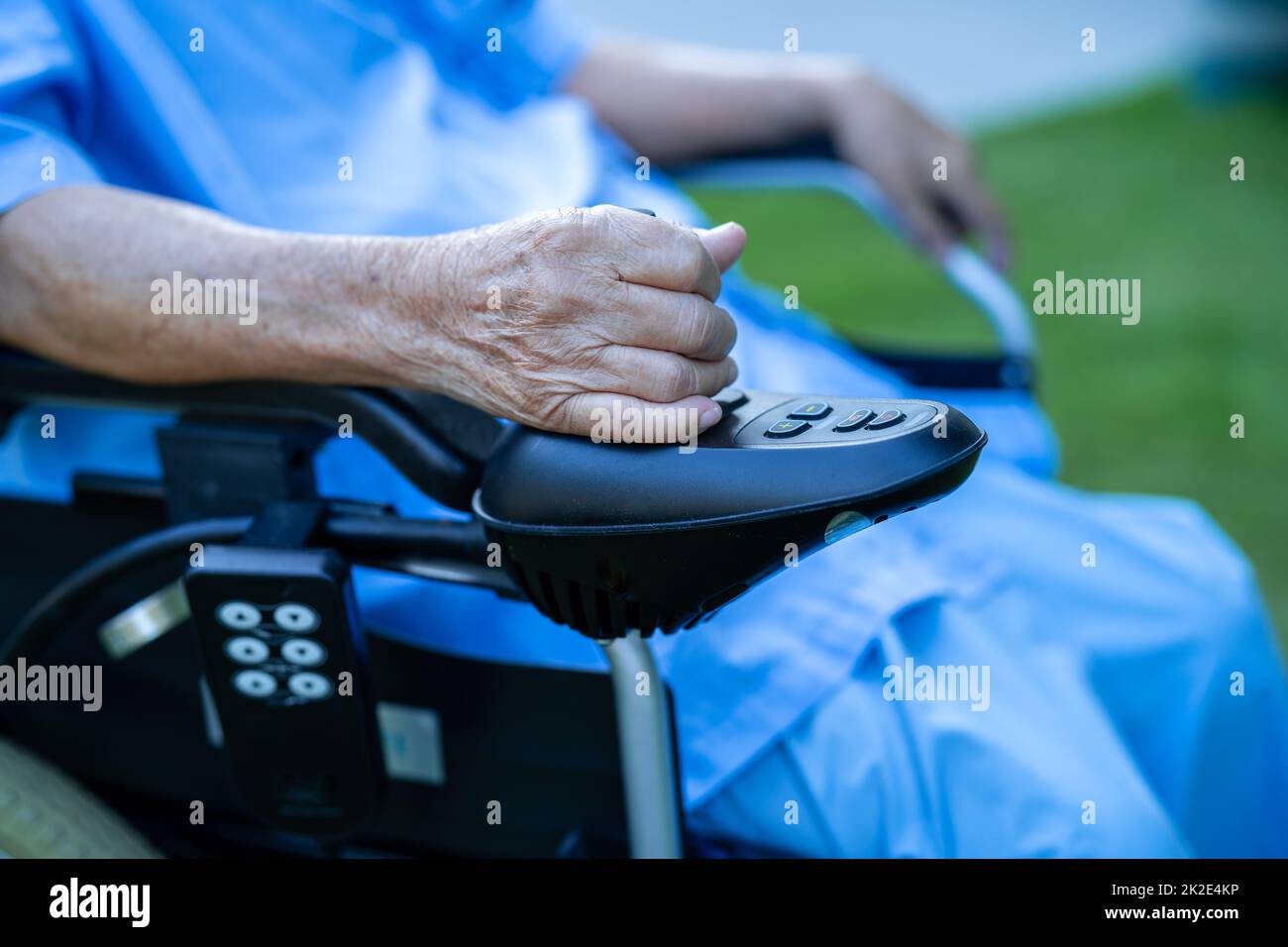 Asian senior or elderly old lady woman patient on electric wheelchair ...