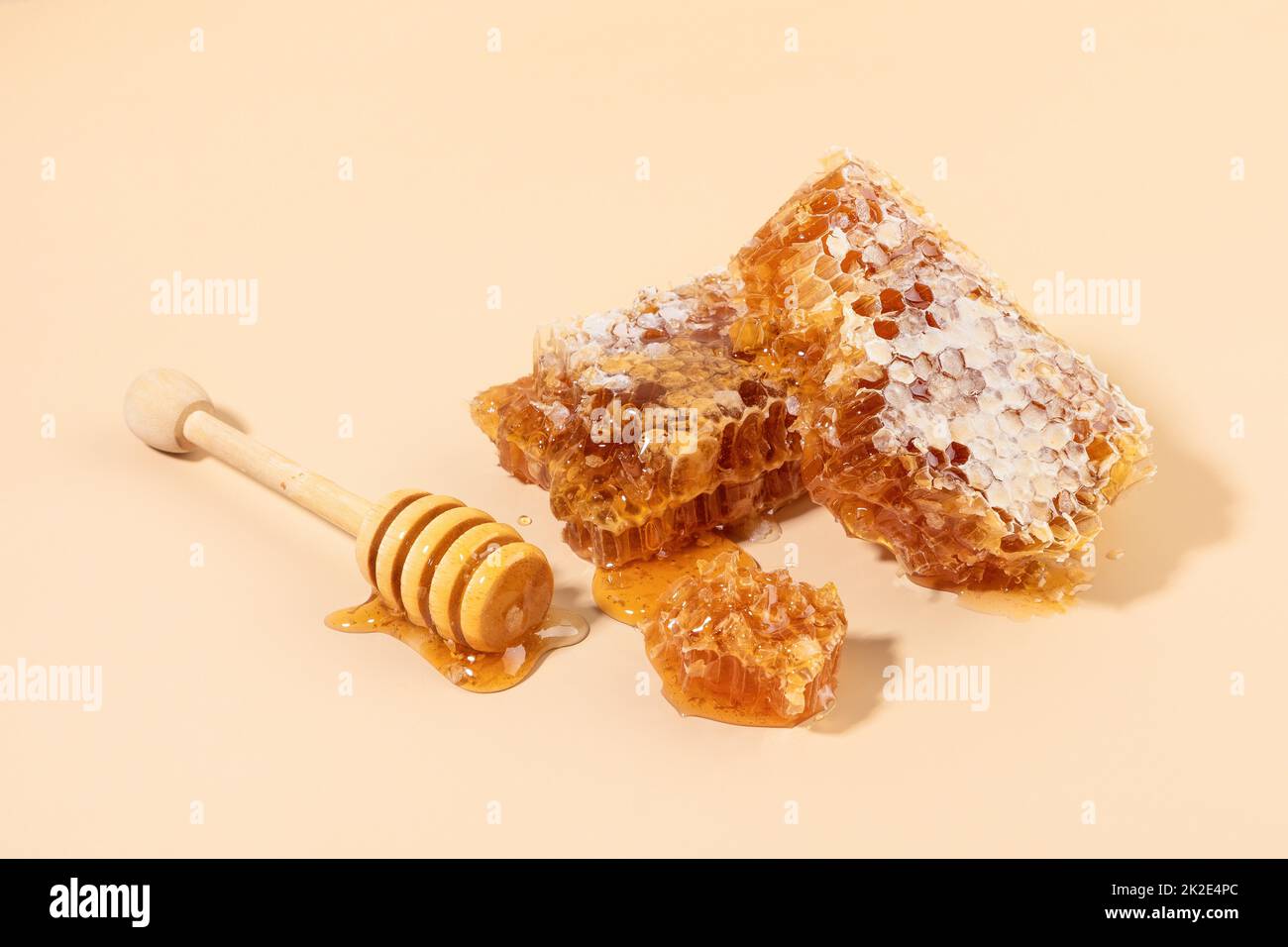 sliced honeycomb and honey dipper stick Stock Photo - Alamy