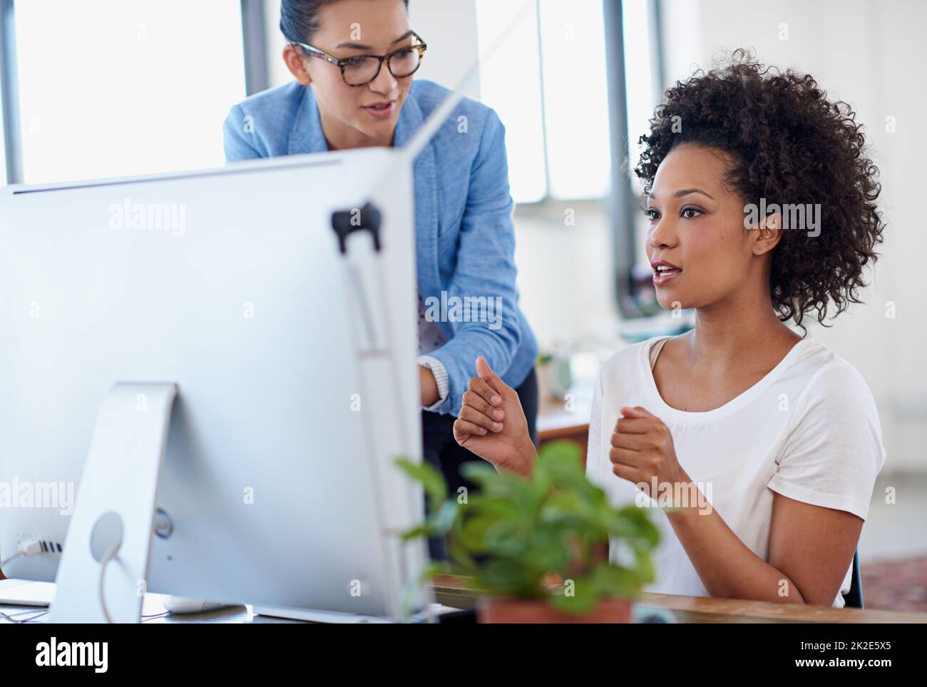 Coming up with some awesome ideas. Shot of two colleagues having a ...