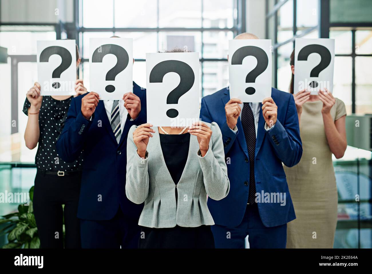 Business team holding question marks hi-res stock photography and ...