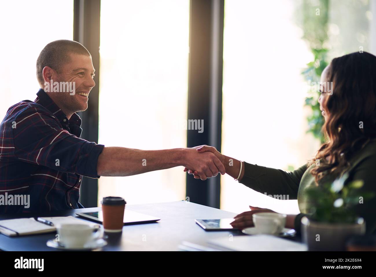 Its a pleasure doing business with you. Shot of two cheerful ...