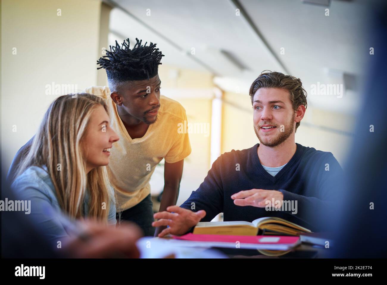 Students working together book hi-res stock photography and images - Alamy