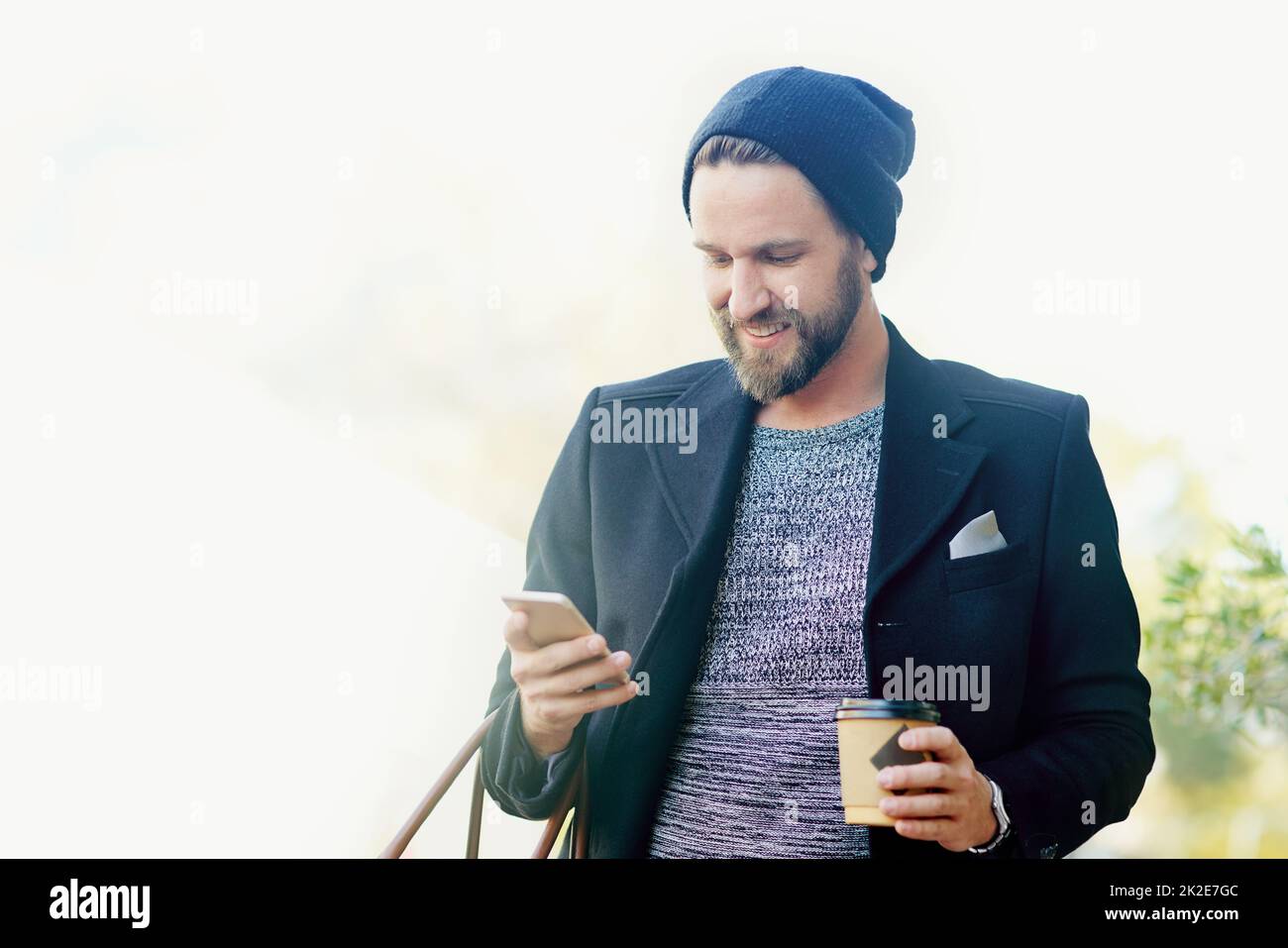 The city life is all about staying connected. Cropped shot of a young ...