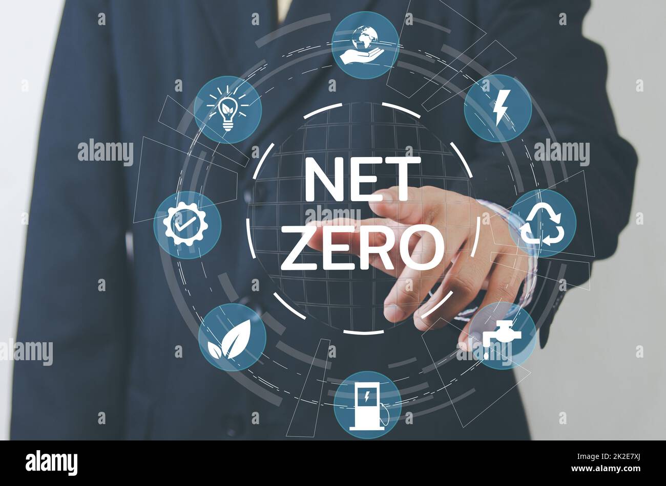 Businessman touching net zero save the eco world and reduce pollution virtual screen. virtual ...