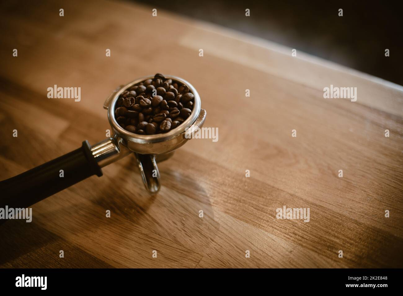 Fresh roasted coffee beans in an espresso filter Stock Photo - Alamy