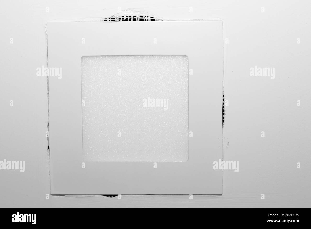 Ceiling around an LED Square Light Not Patched or Filled in Well Stock ...