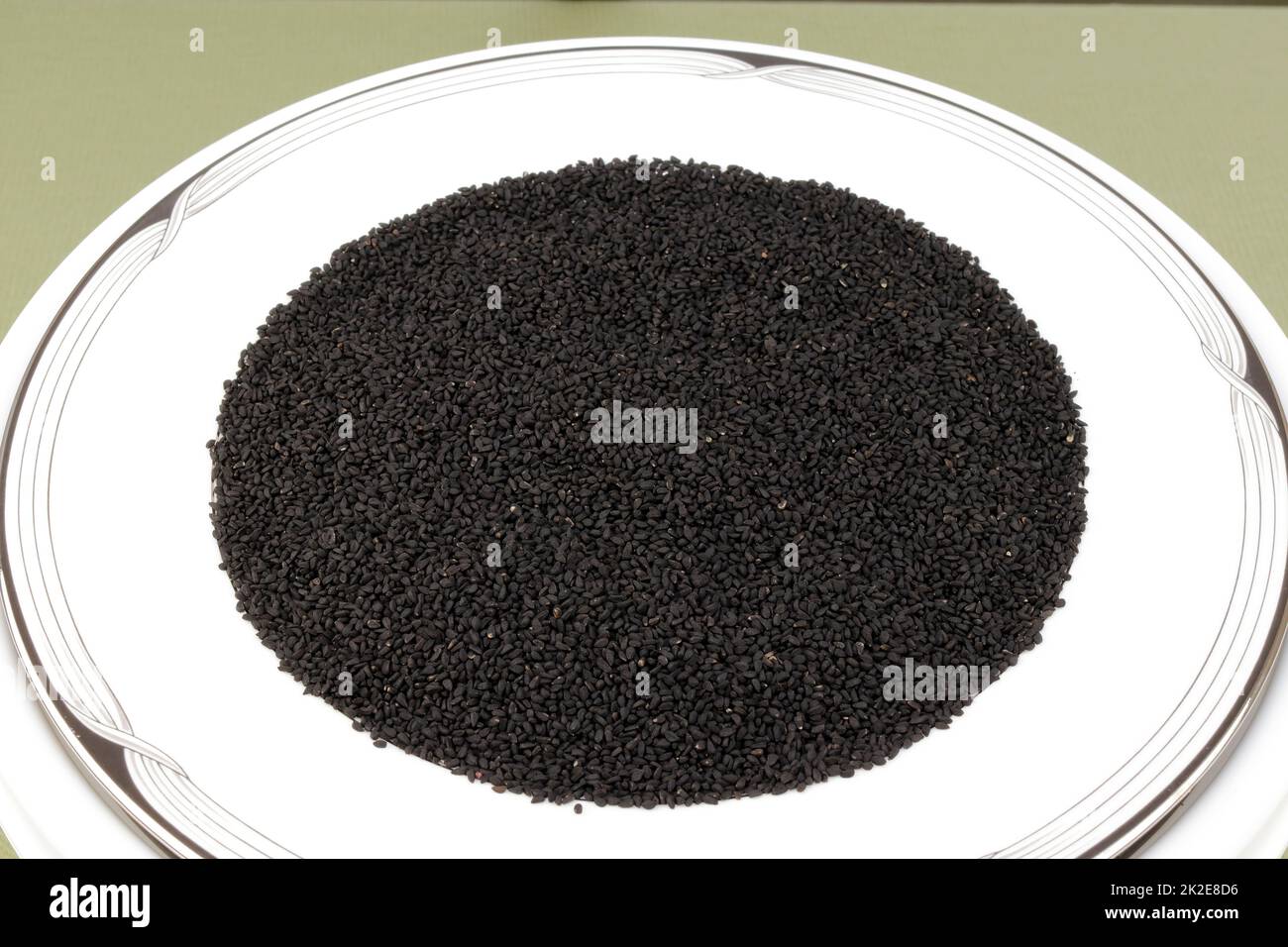 Nigella Sativa Black Seeds on a White Plate with Embellishments Stock ...
