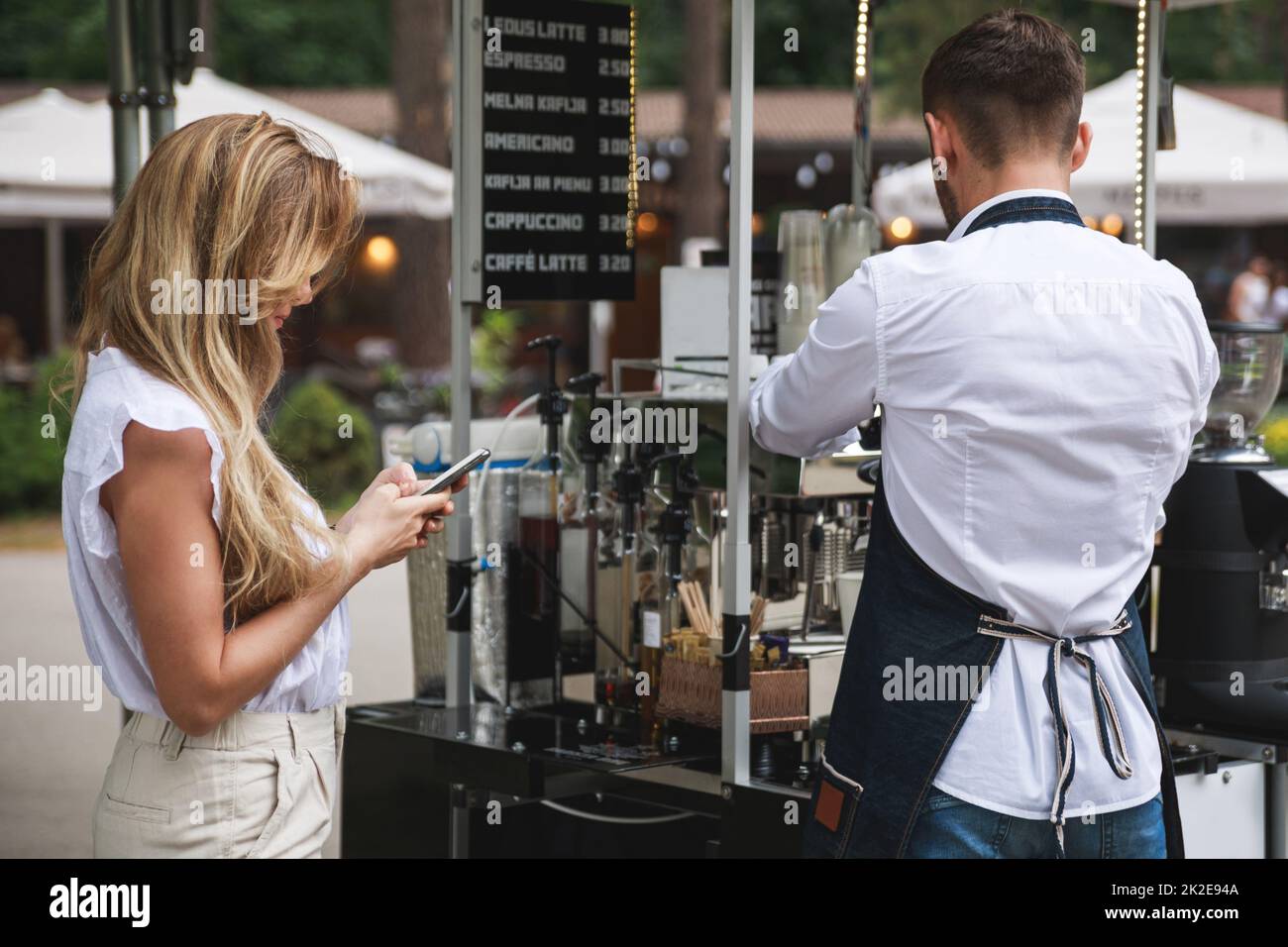 Barista man making coffee for the customer in his coffee shop Stock ...