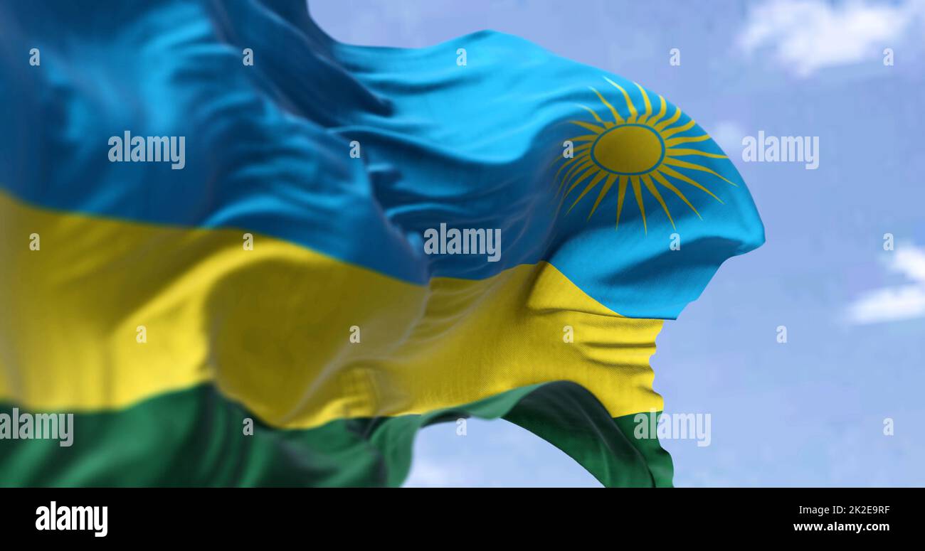 Detail of the national flag of Rwanda waving in the wind on a clear day ...