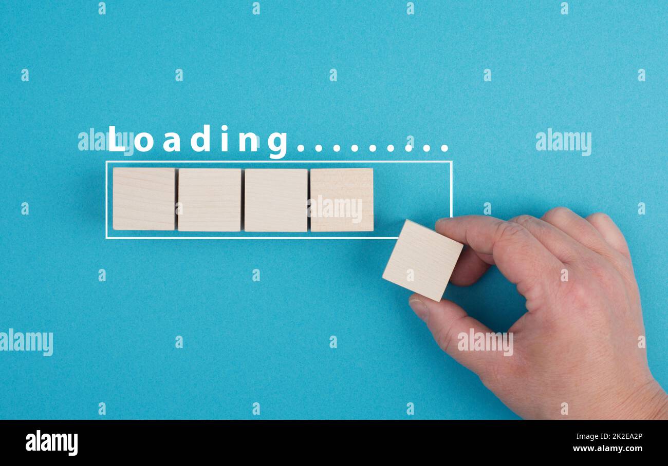 The word loading is standing over the progress bar, hand puts last cube ...