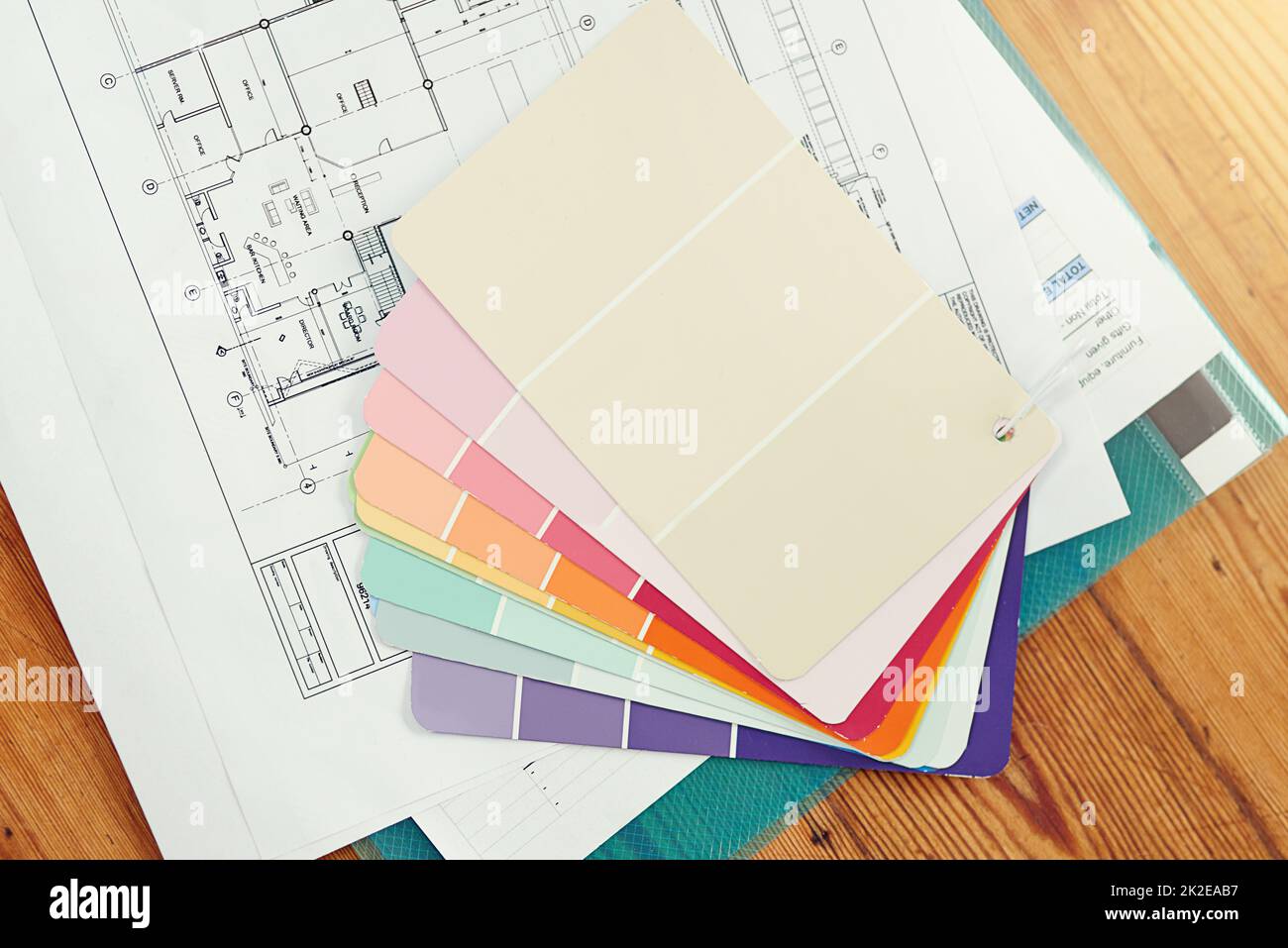 Desk essentials for a successful architect. High angle shot of color ...