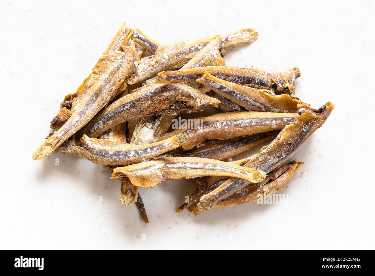 handful of dried anchovy fishes close up on gray Stock Photo - Alamy