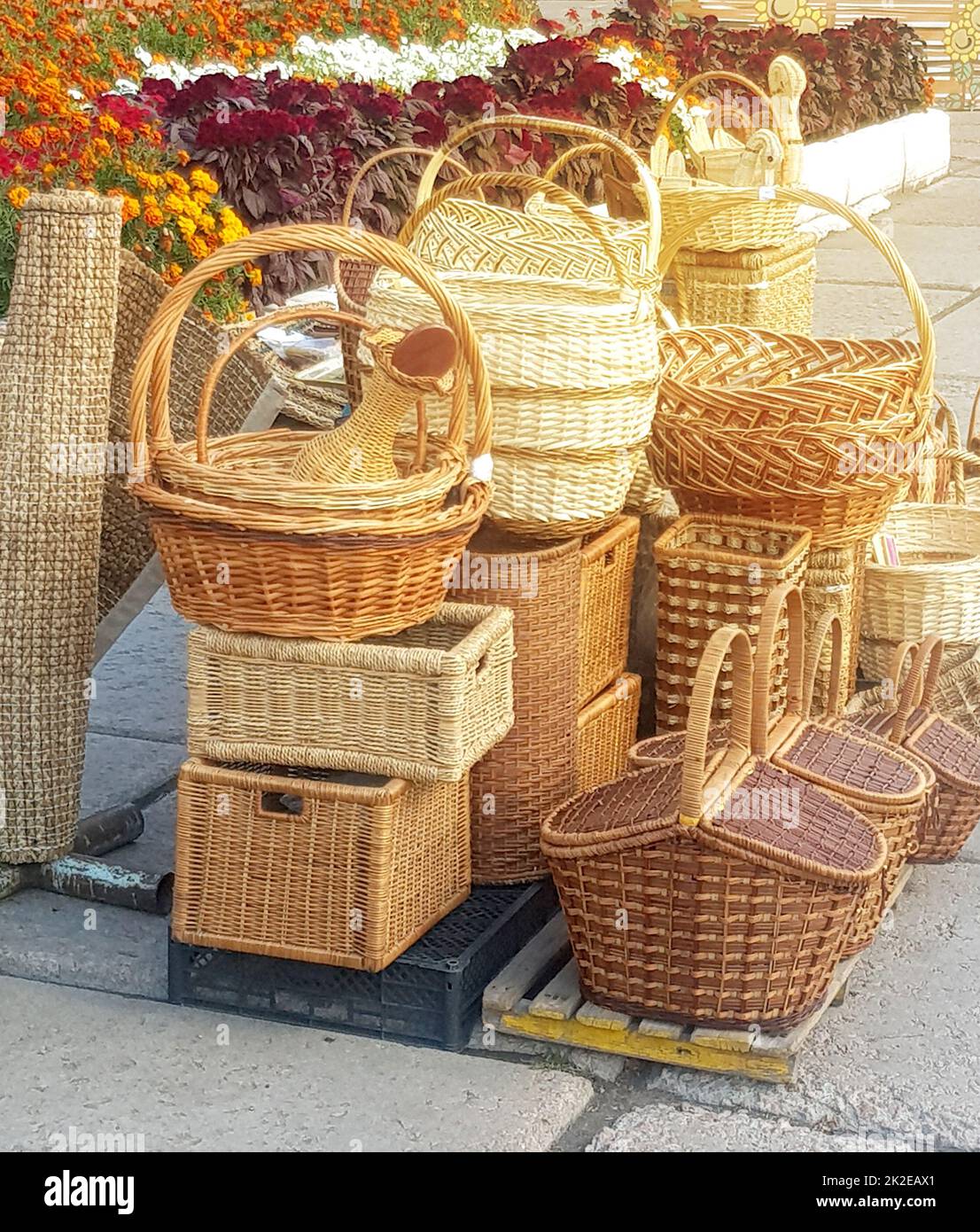 Many different wicker baskets and boxes made of natural material, close ...