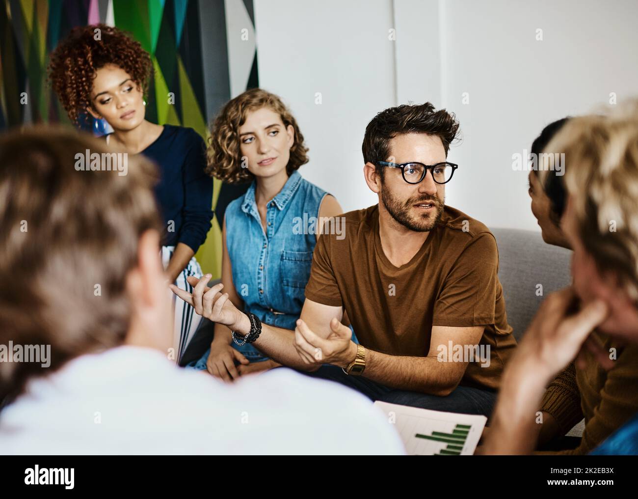 Exploring the possibilities. Shot of a group of designers having a ...