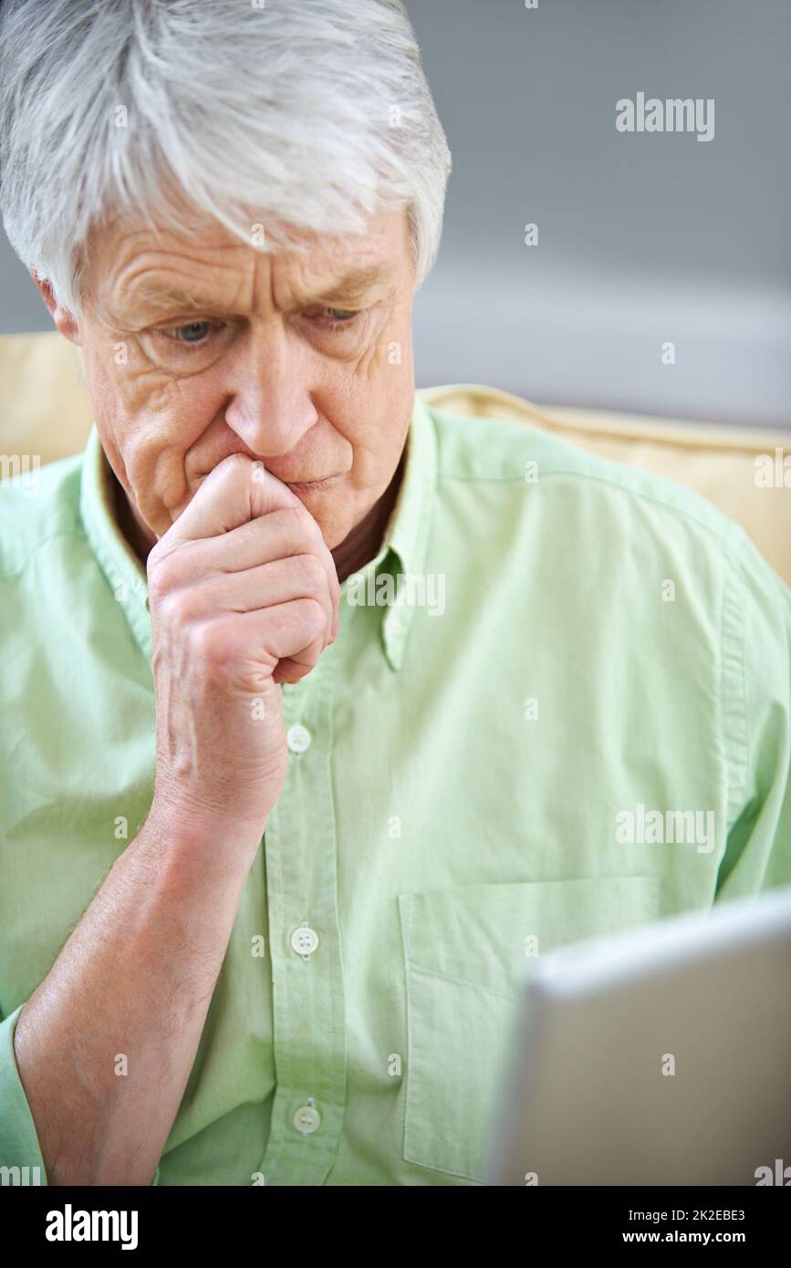 Well thats new...an elderly man deep looking thoughtful while using a ...