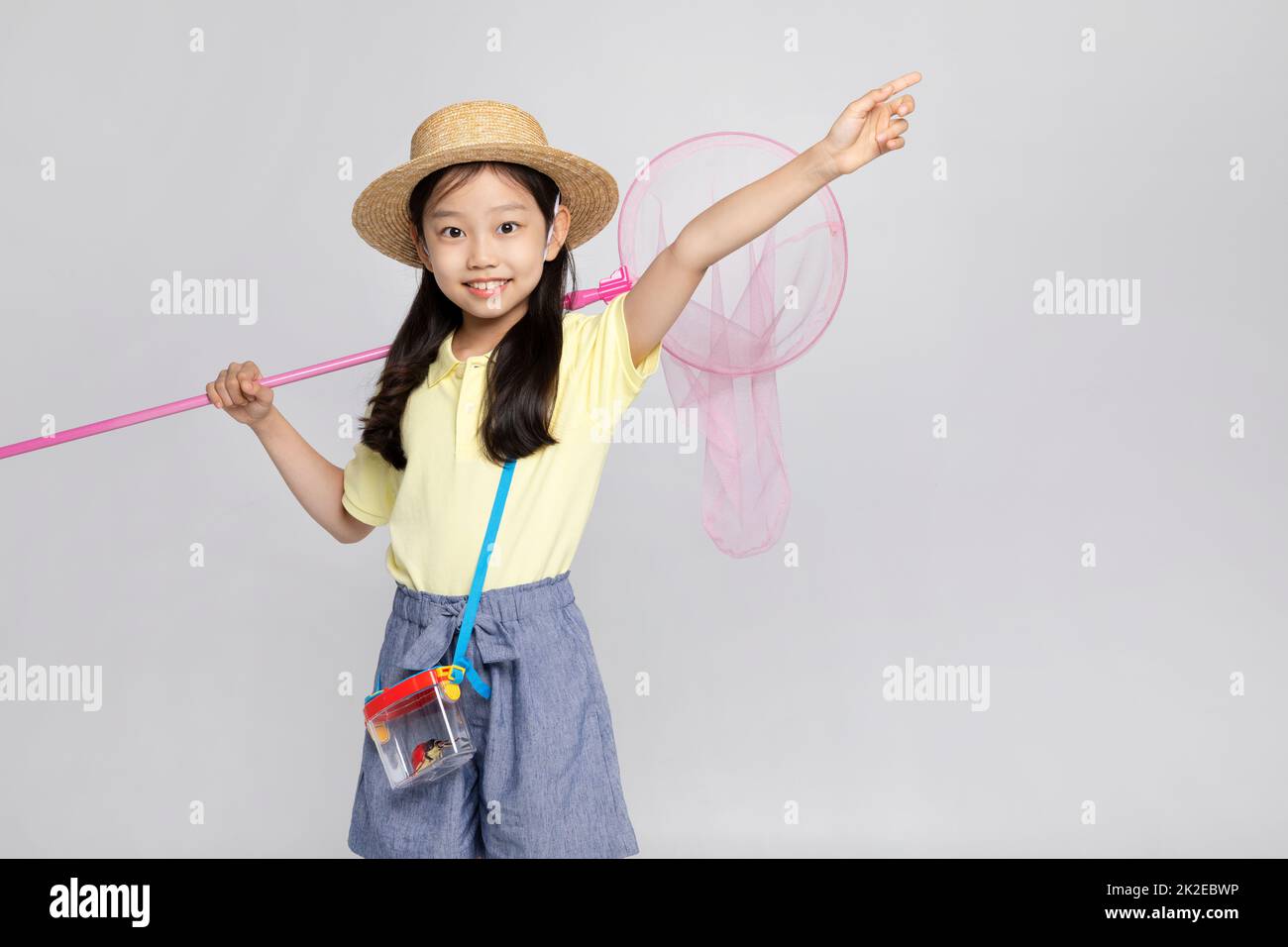 Korean young girl wearing gym clothes in white background studio insect ...
