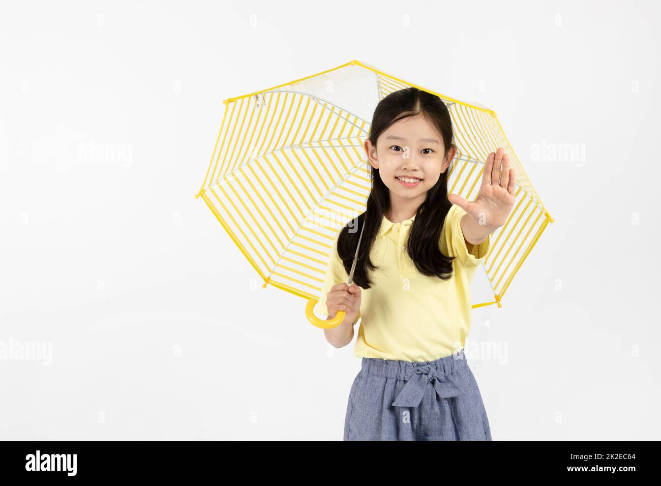 cute young Korean girl, rainy season concept in white background studio ...