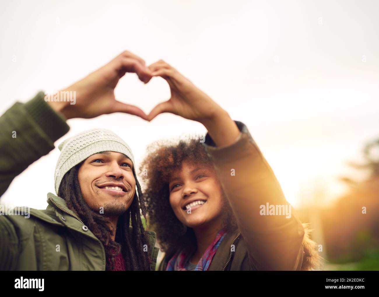 Two People Making A Heart With Their Hands