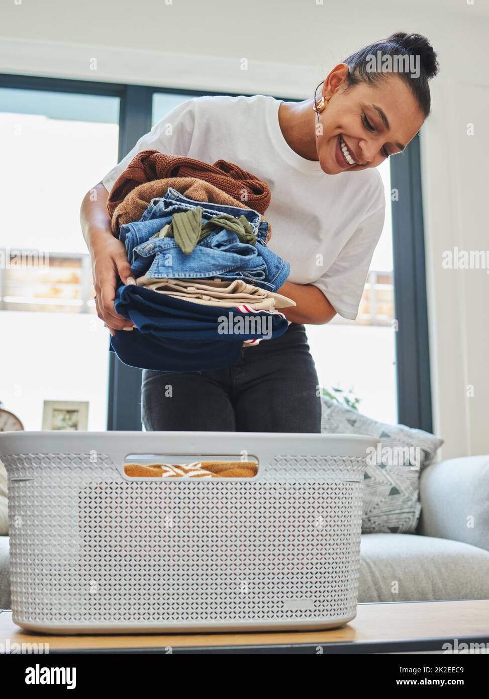 Woman carrying laundry basket hi-res stock photography and images - Alamy