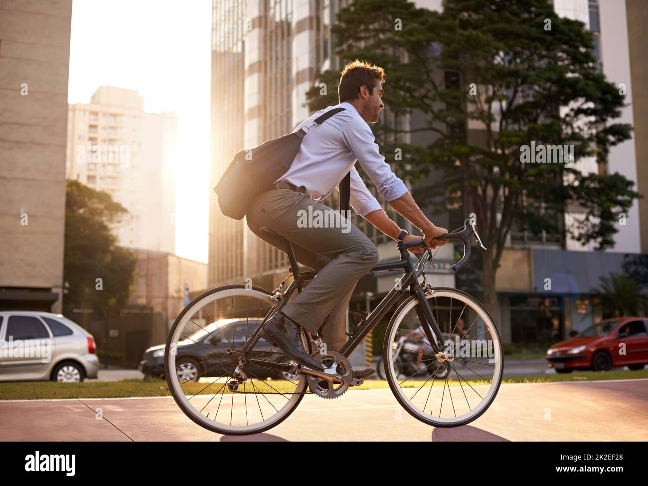 The best city transportation. a businessman commuting to work with his ...